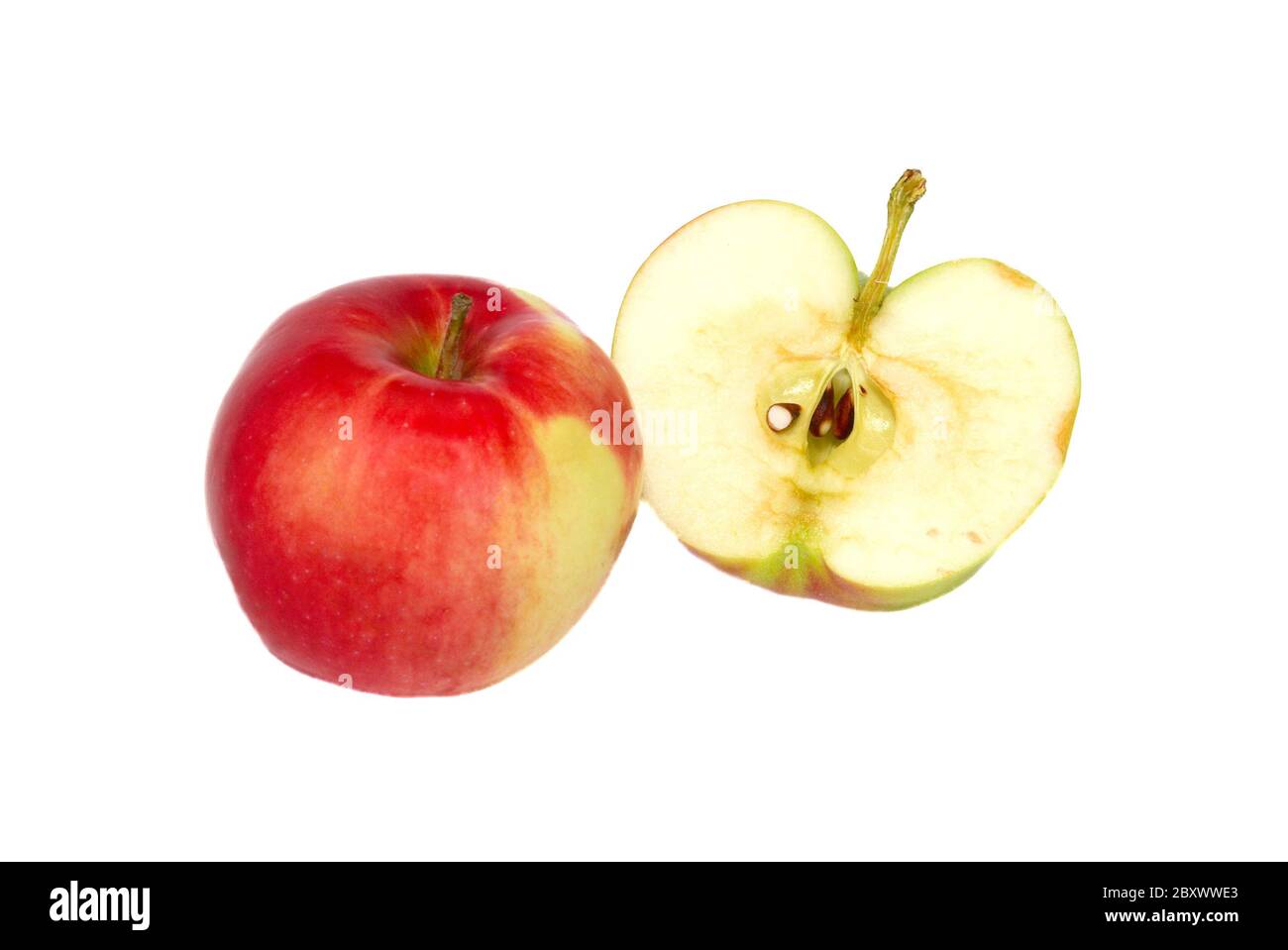 Red fresh apple and half isolated on white Stock Photo - Alamy