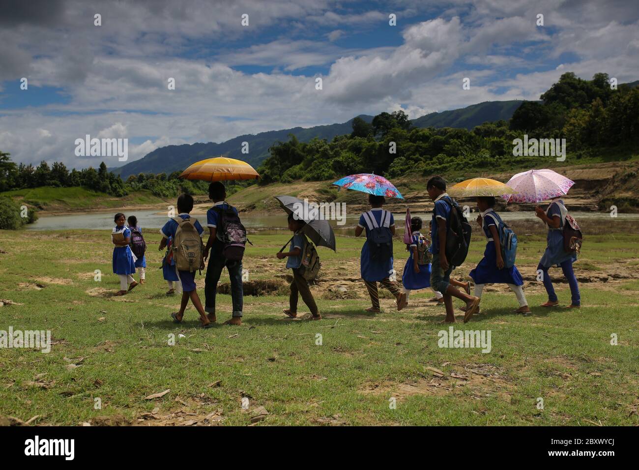 Students walk along the Sangu River at Thanchi in Bandarban, Bangladesh ...