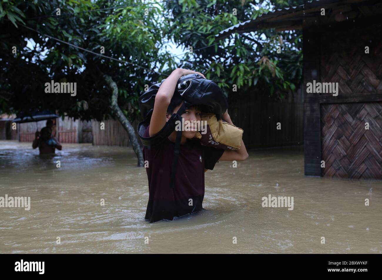 Flood affected indigenous people move toward the shelter center in ...