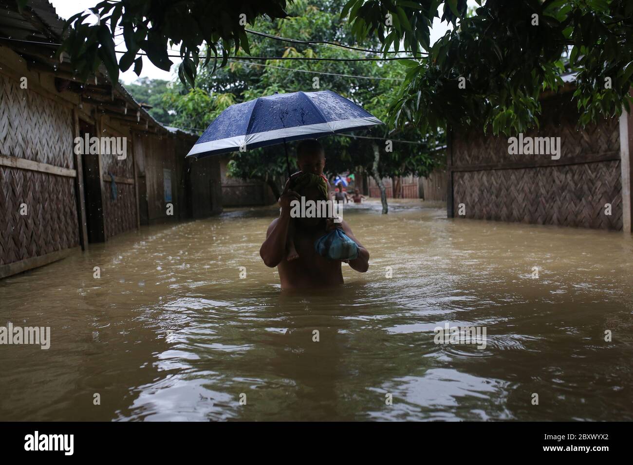 Flood affected indigenous people move toward the shelter center in ...