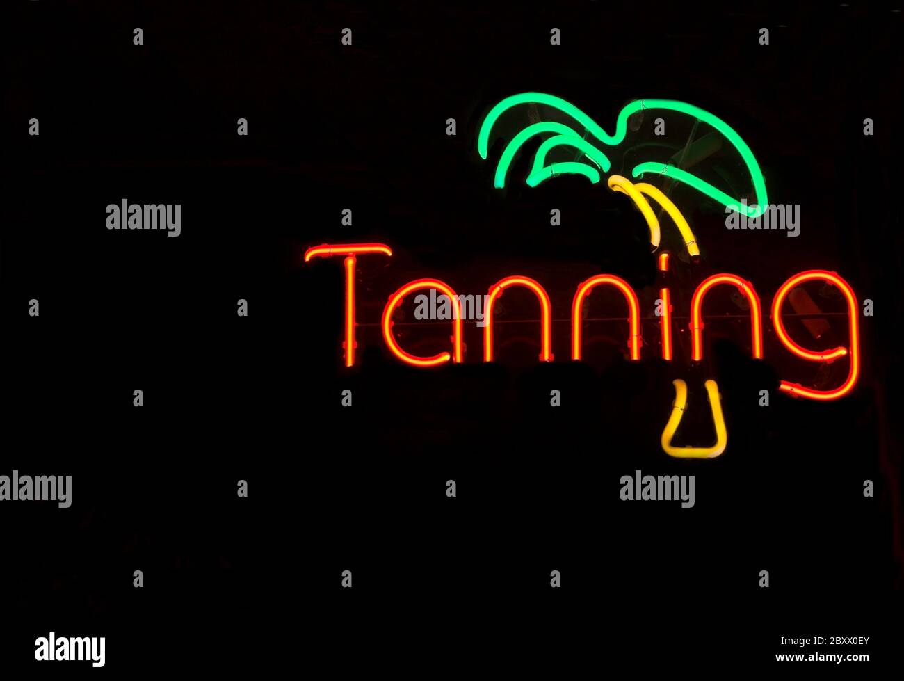 Neon Tanning Sign Stock Photo - Alamy