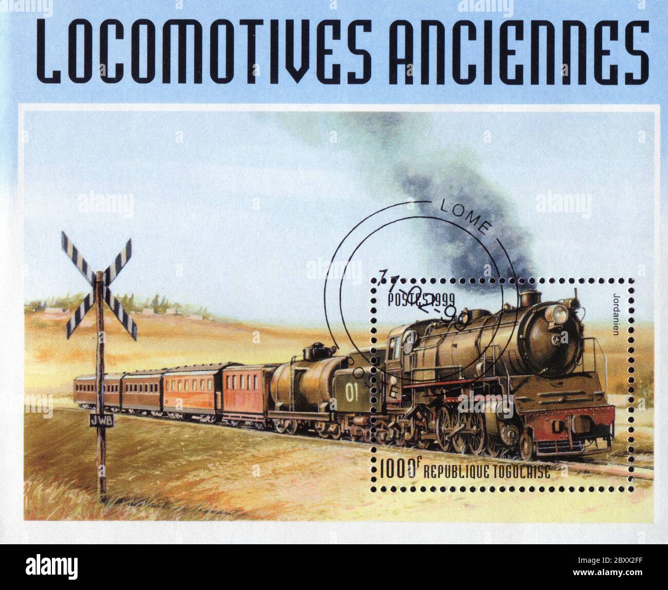 TOGOLESE REPUBLIC -CIRCA 1999: Ancient train with a steam locomotive ...