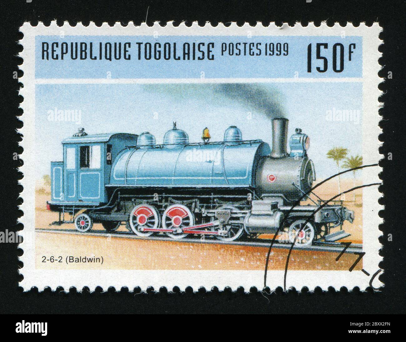 TOGOLESE REPUBLIC -CIRCA 1999: Ancient train with a steam locomotive ...