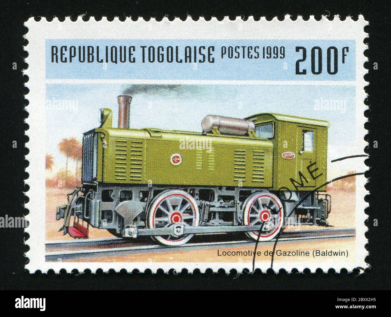 TOGOLESE REPUBLIC -CIRCA 1999: Ancient train with a steam locomotive ...