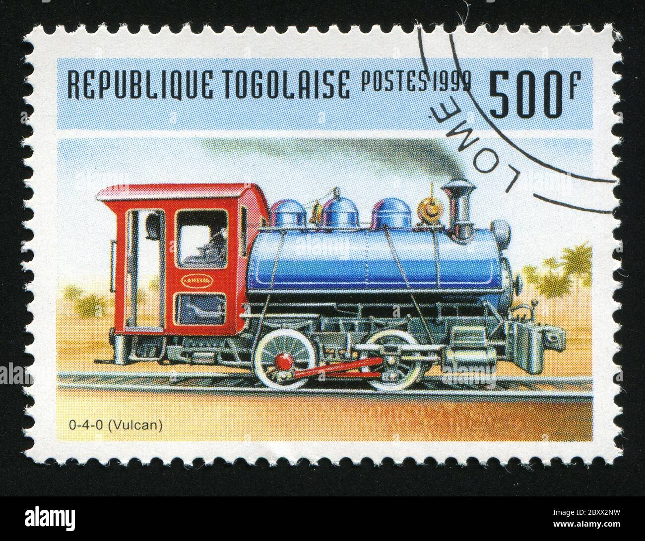 TOGOLESE REPUBLIC -CIRCA 1999: Ancient train with a steam locomotive ...