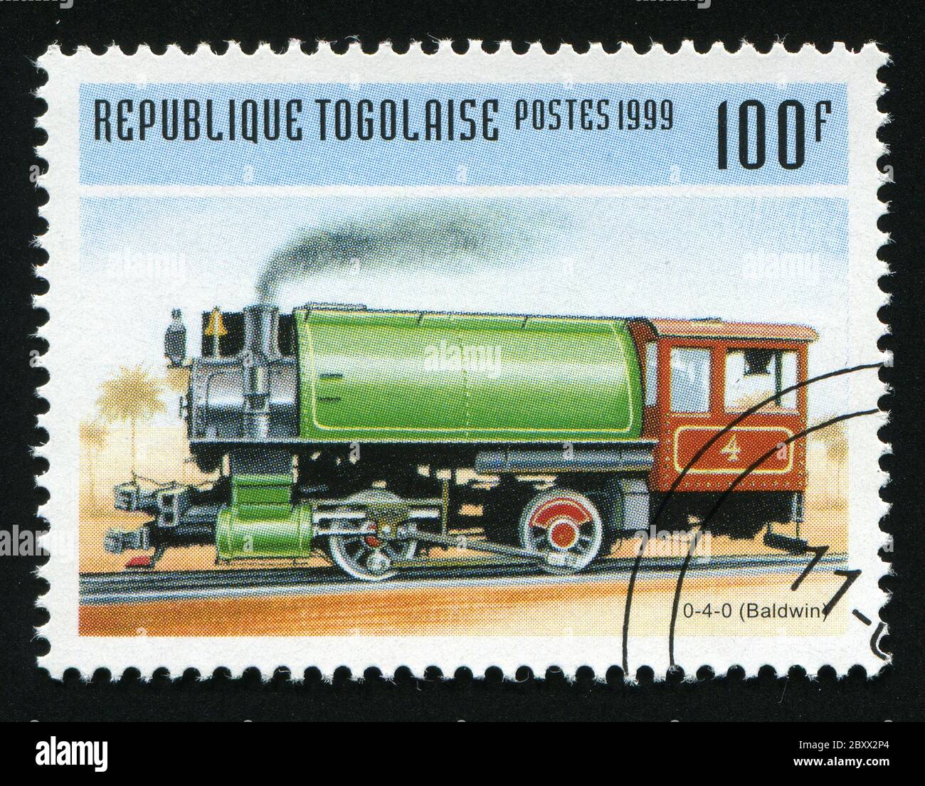 TOGOLESE REPUBLIC -CIRCA 1999: Ancient train with a steam locomotive ...