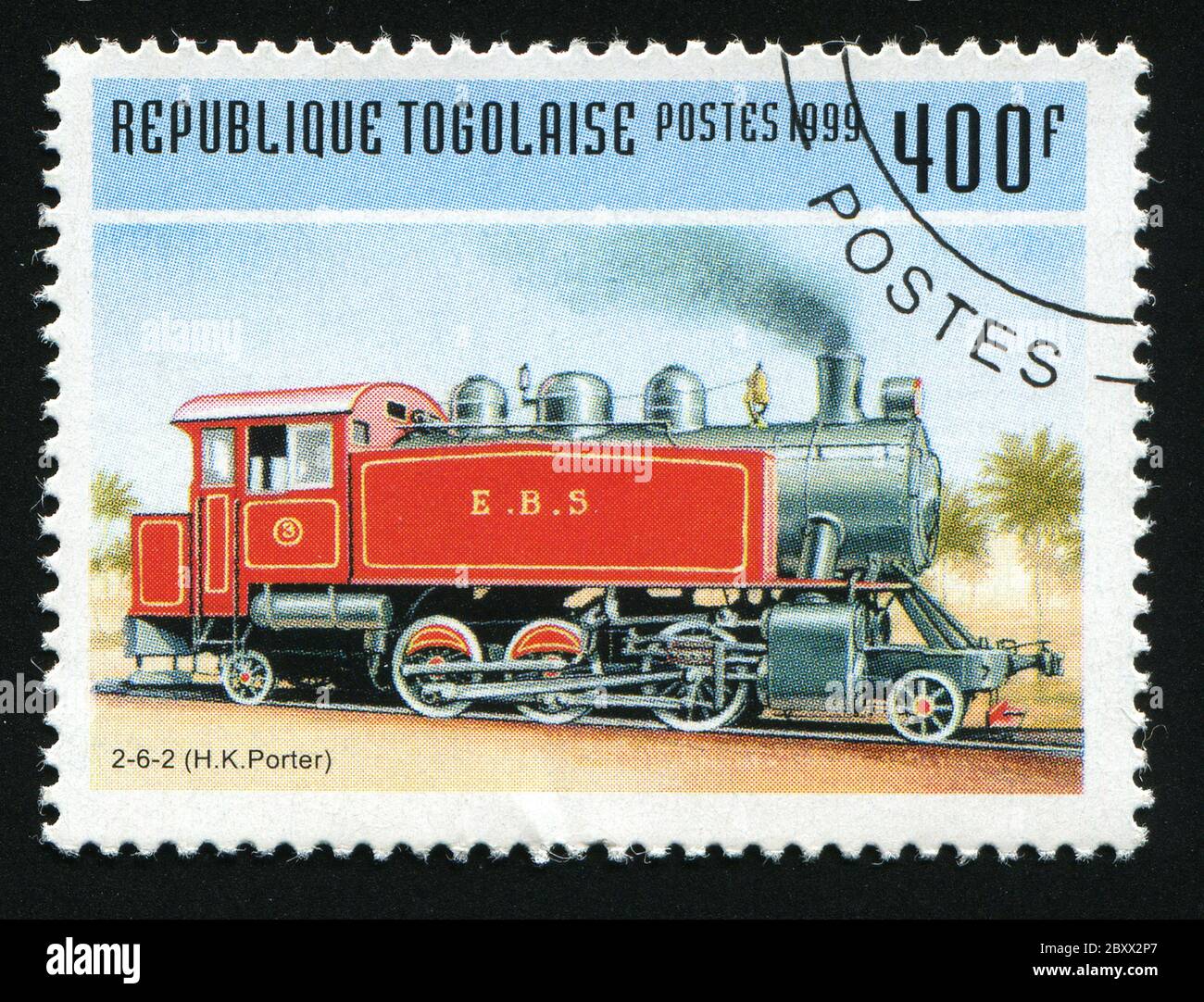 TOGOLESE REPUBLIC -CIRCA 1999: Ancient train with a steam locomotive ...