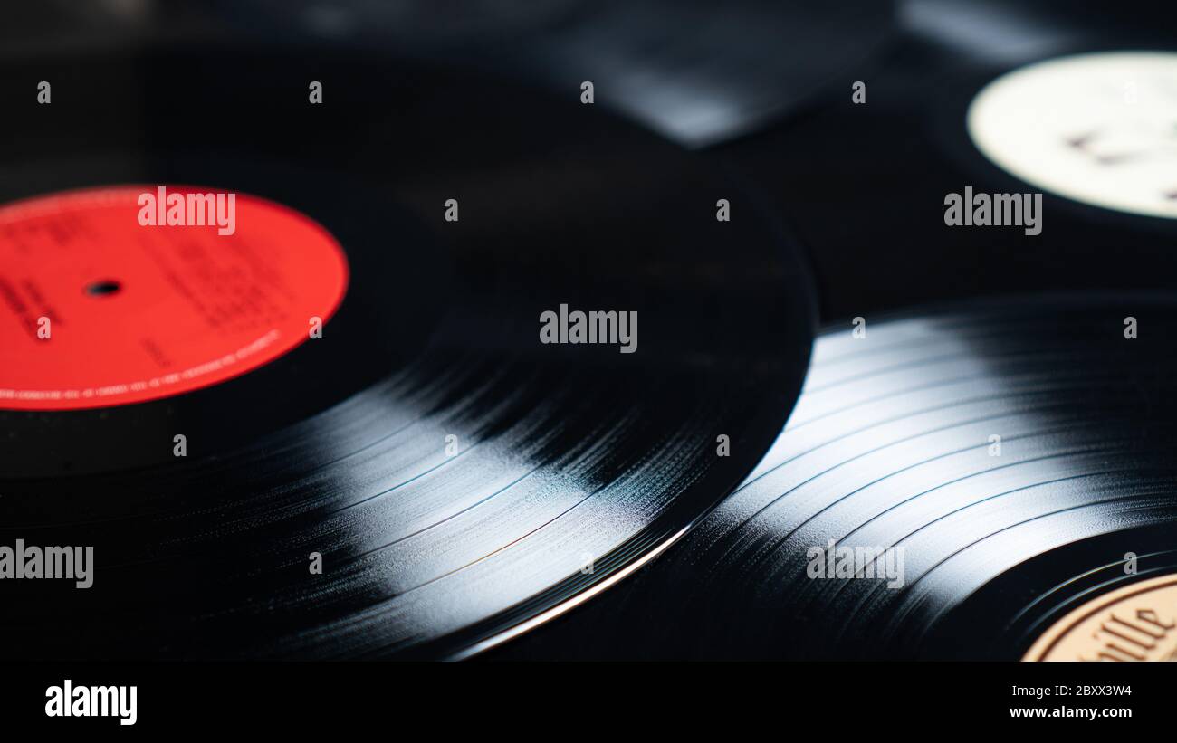 Top view of very close up scattered vinyl disks background in hard ...