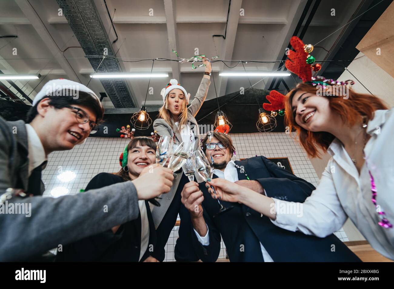 Happy colleagues in office celebrate special event Stock Photo - Alamy