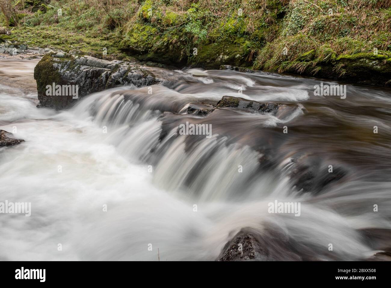 Long exposure of a waterfall on the East Lyn river at Watersmeet in ...