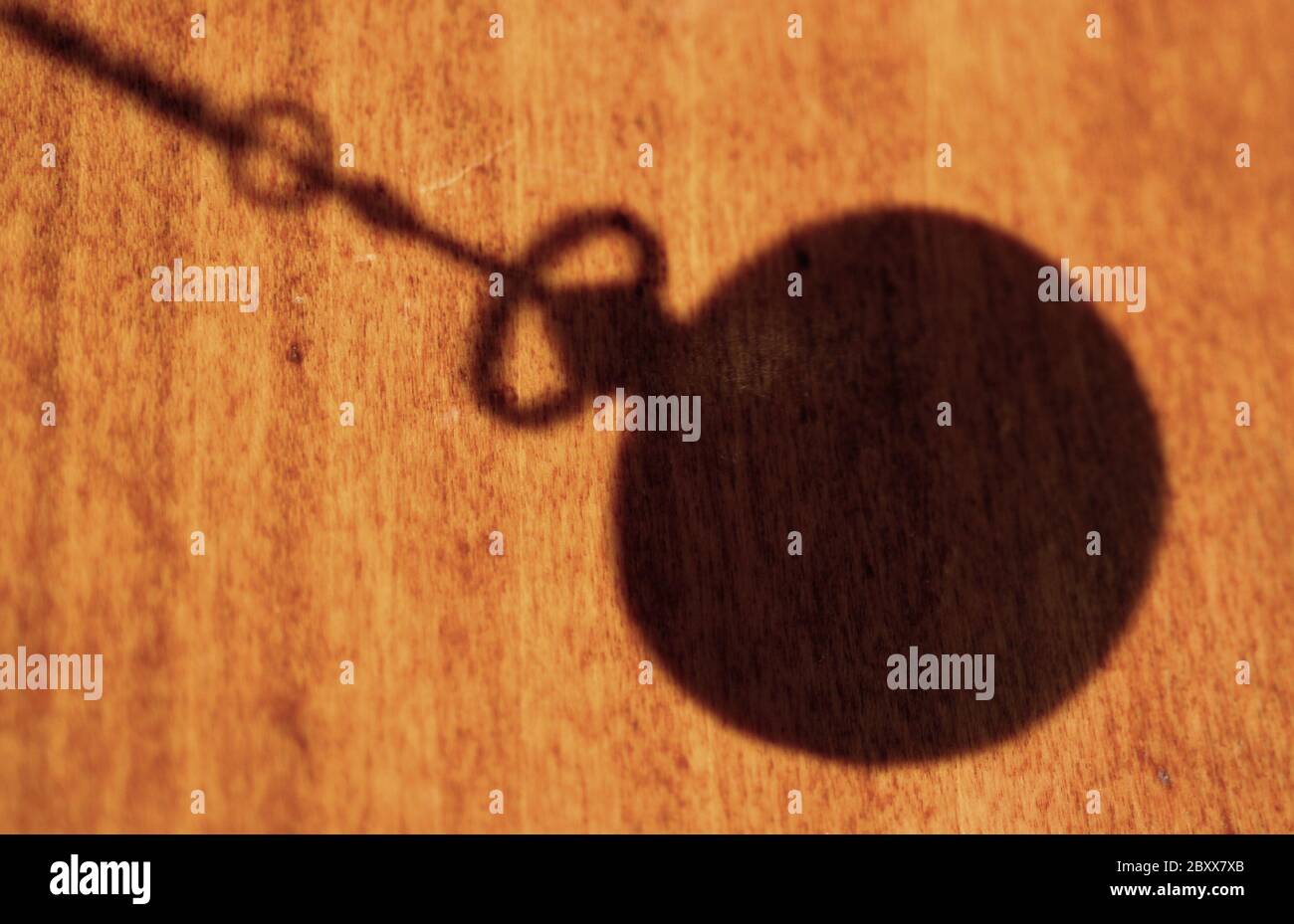 Old pocket watch shadow on wood Stock Photo - Alamy