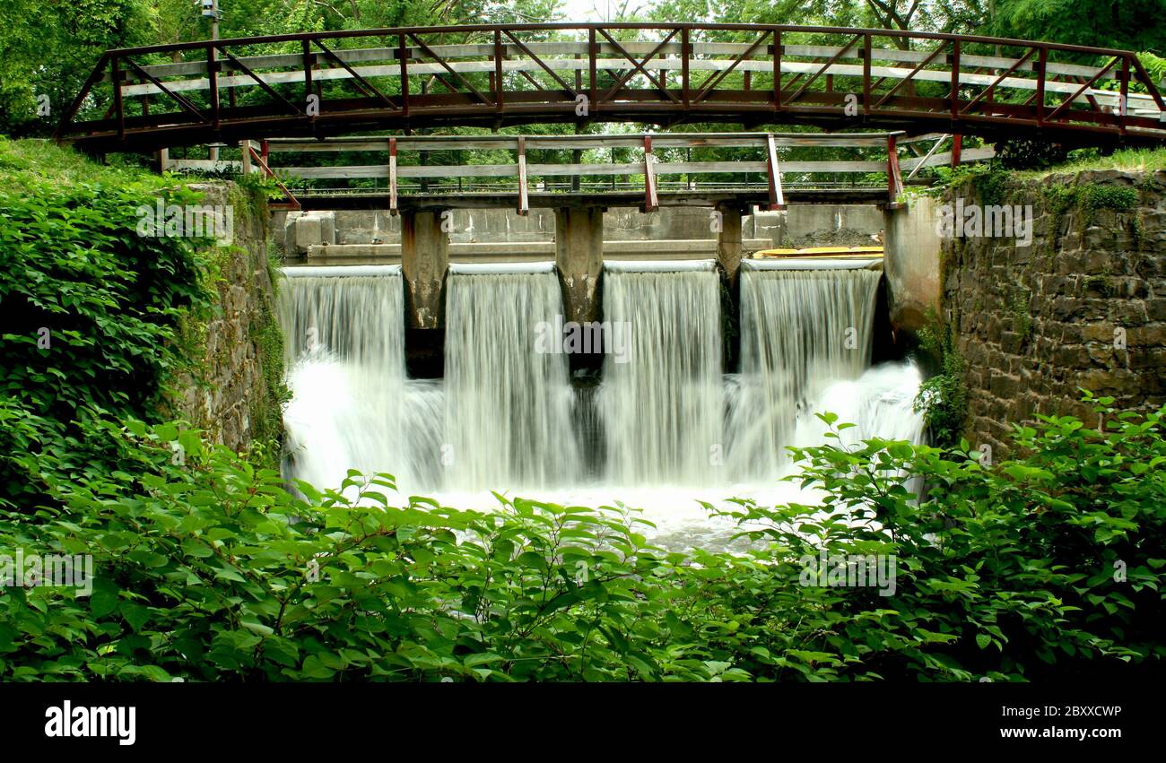 A bridge on a canal spillway Stock Photo - Alamy