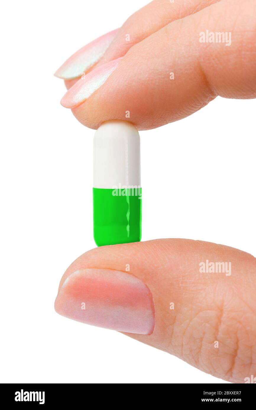Hand and pill Stock Photo - Alamy
