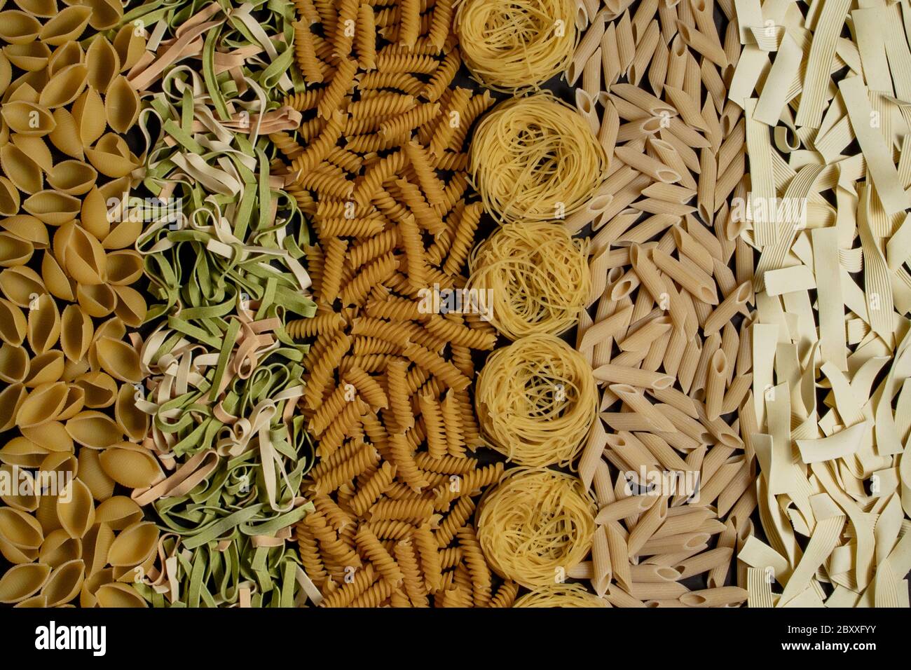 Variety of types and shapes of dry Italian pasta. Italian Macaroni raw ...