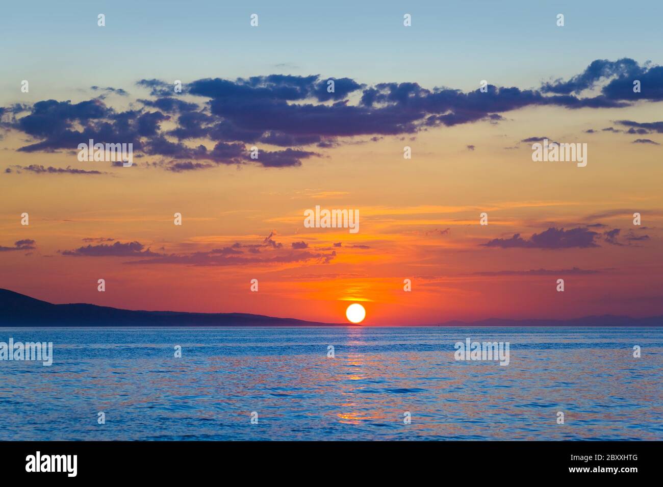 Blue sea on sunset background hi-res stock photography and images - Alamy