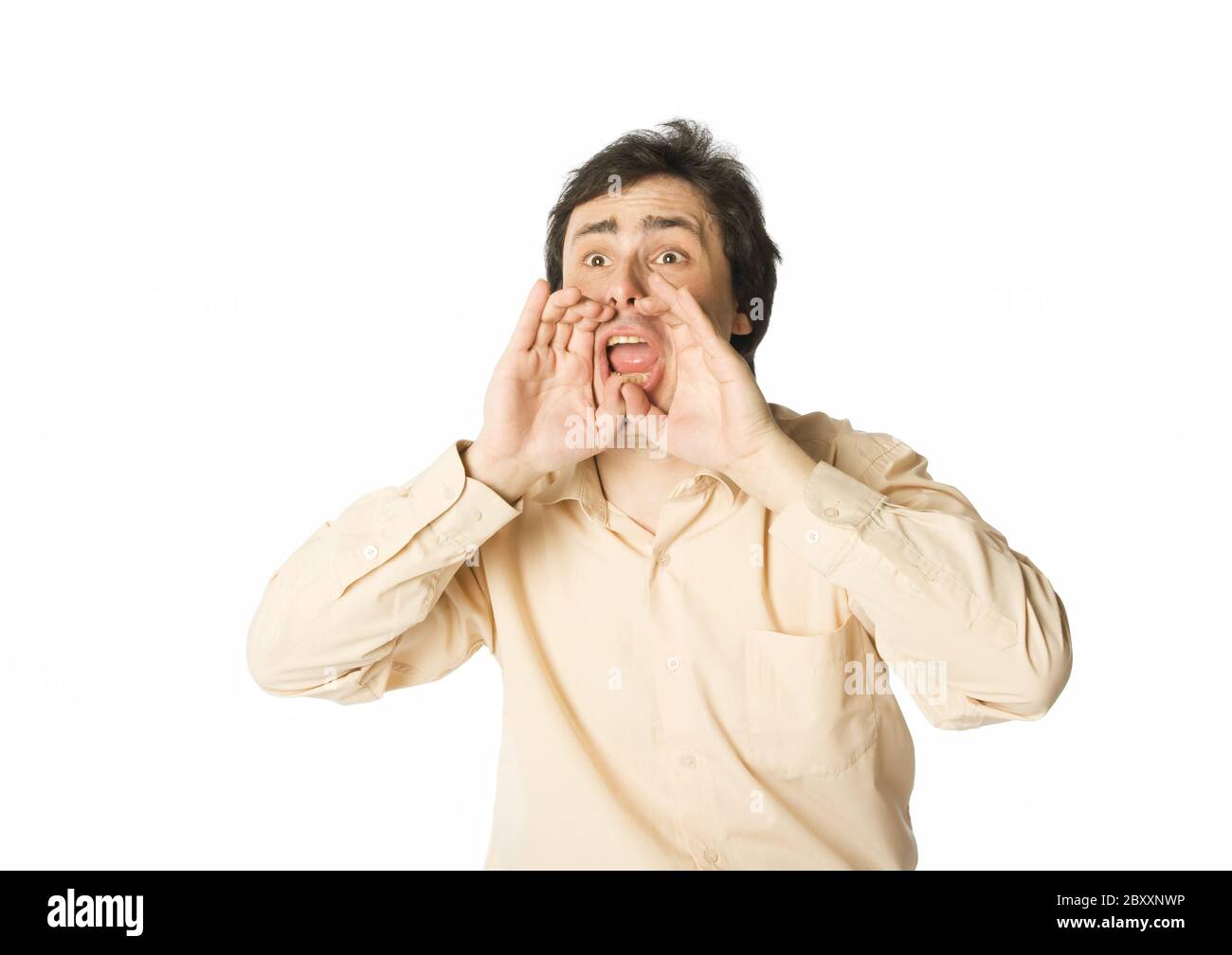 Man shouting, hands near his mouth, over white Stock Photo - Alamy