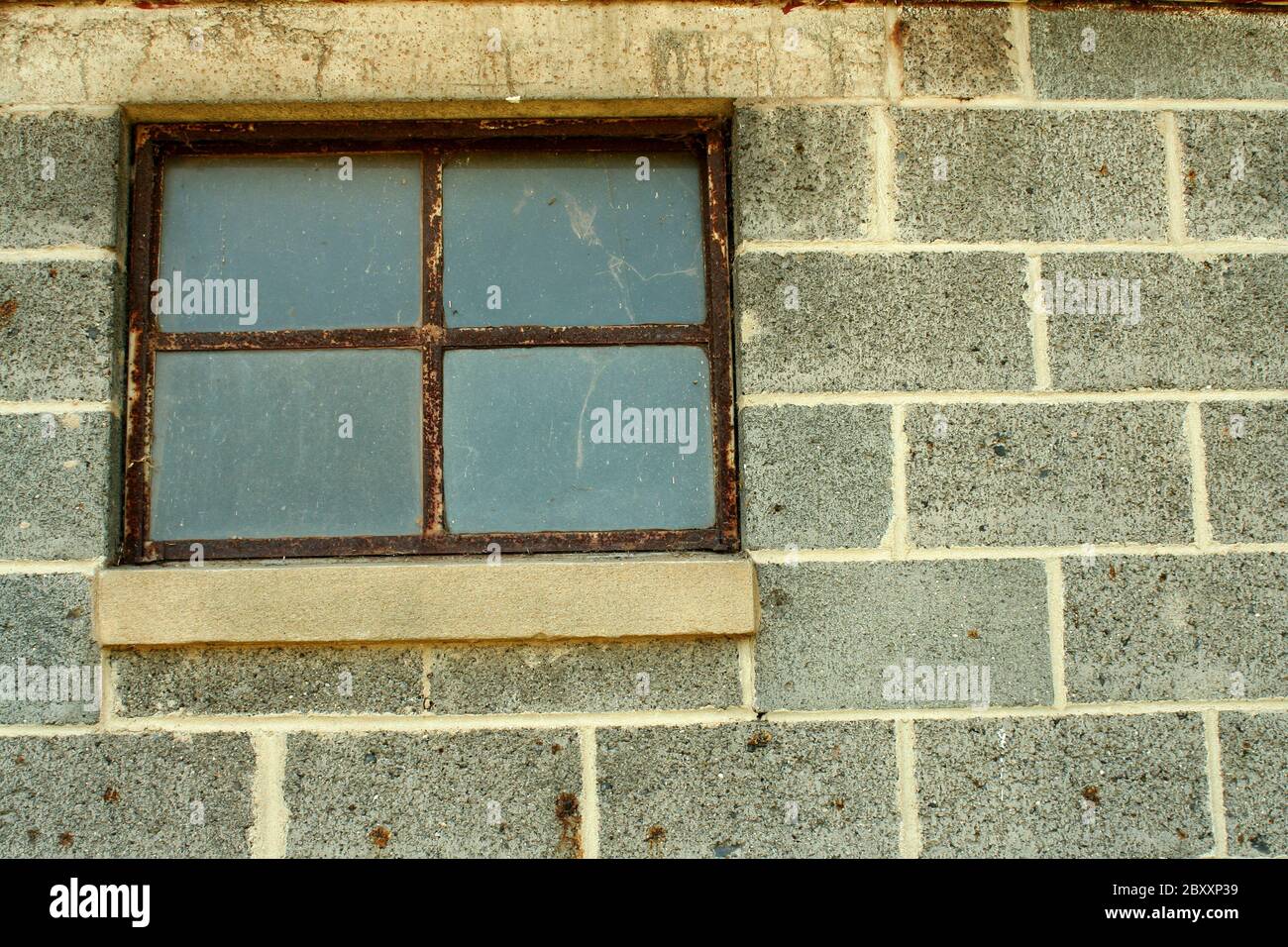 A Concrete block wall with window Stock Photo - Alamy