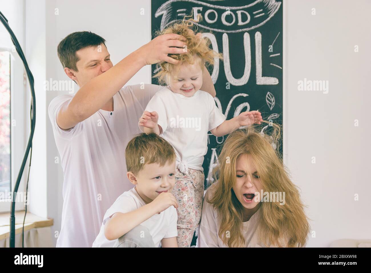 Parents play with kids. Children spend their time with mum and dad ...