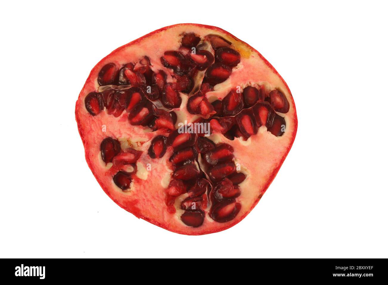 A Isolated Pomegranate half on white background Stock Photo - Alamy