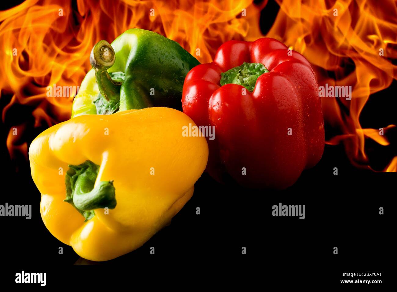 Pepper with fire background Stock Photo - Alamy