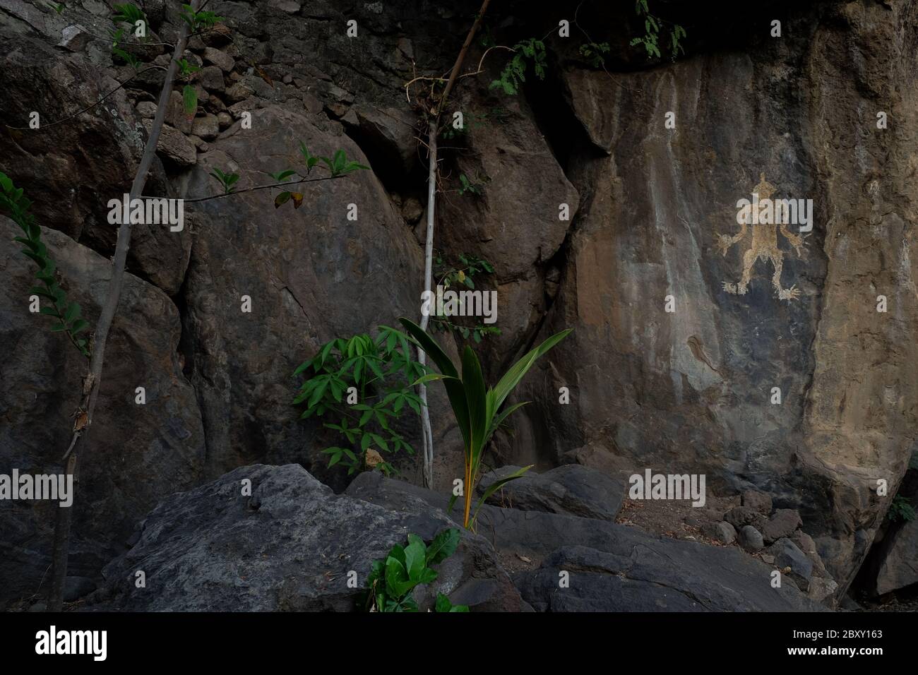An ancient rock painting showing human-like figure in Lembata Island ...