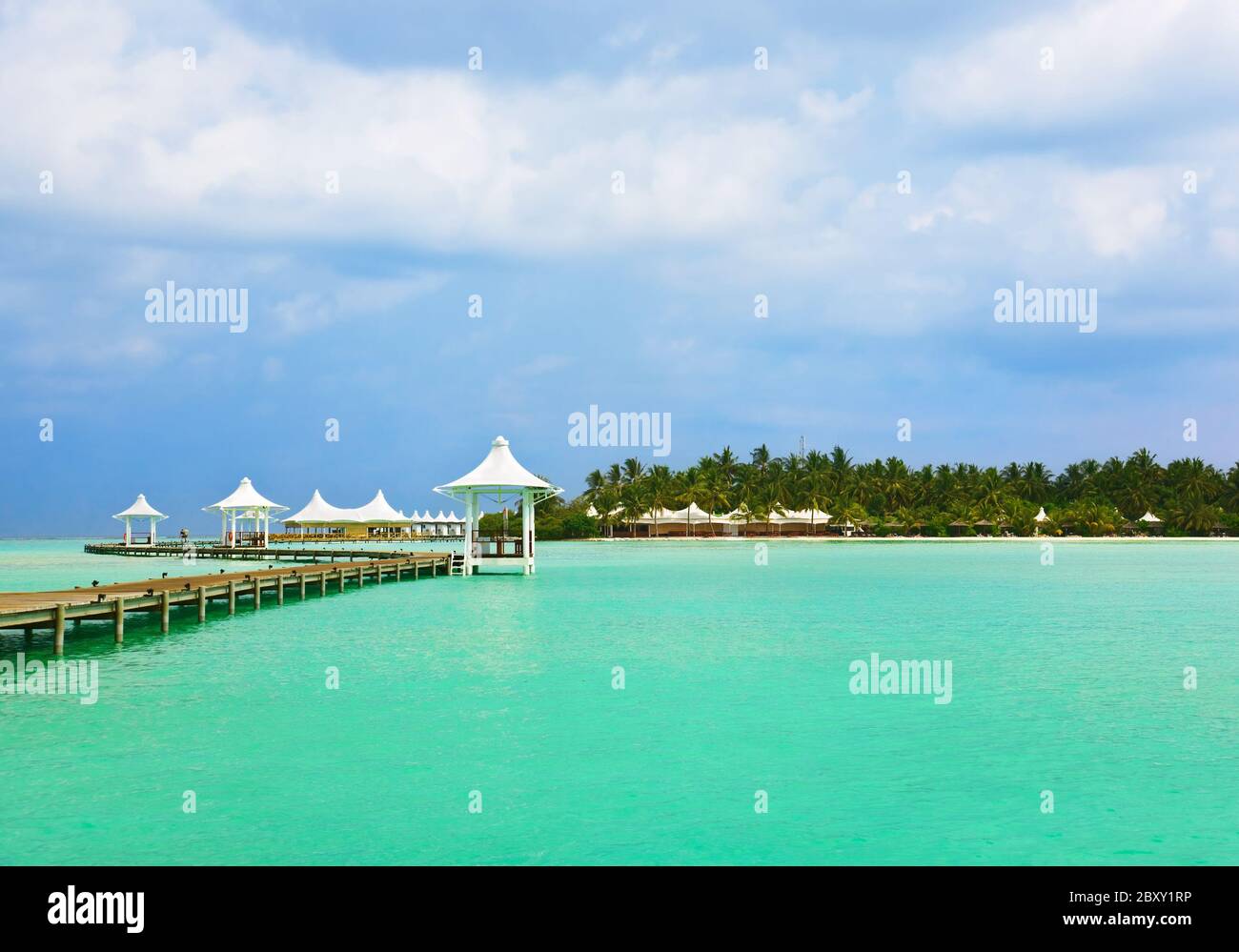 Jetty on a tropical beach at Maldives Stock Photo - Alamy