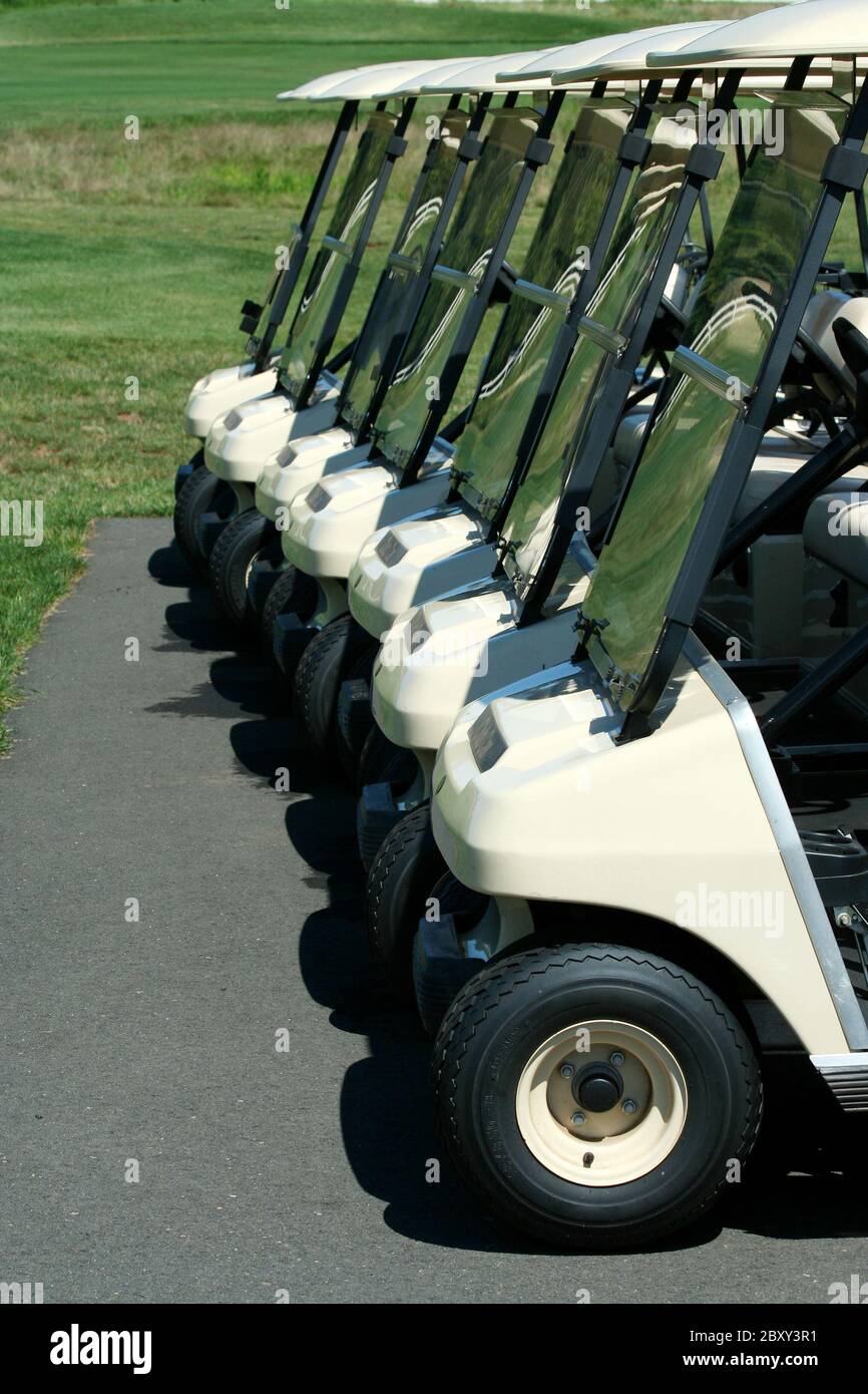 A Front view of a row of golf carts Stock Photo - Alamy