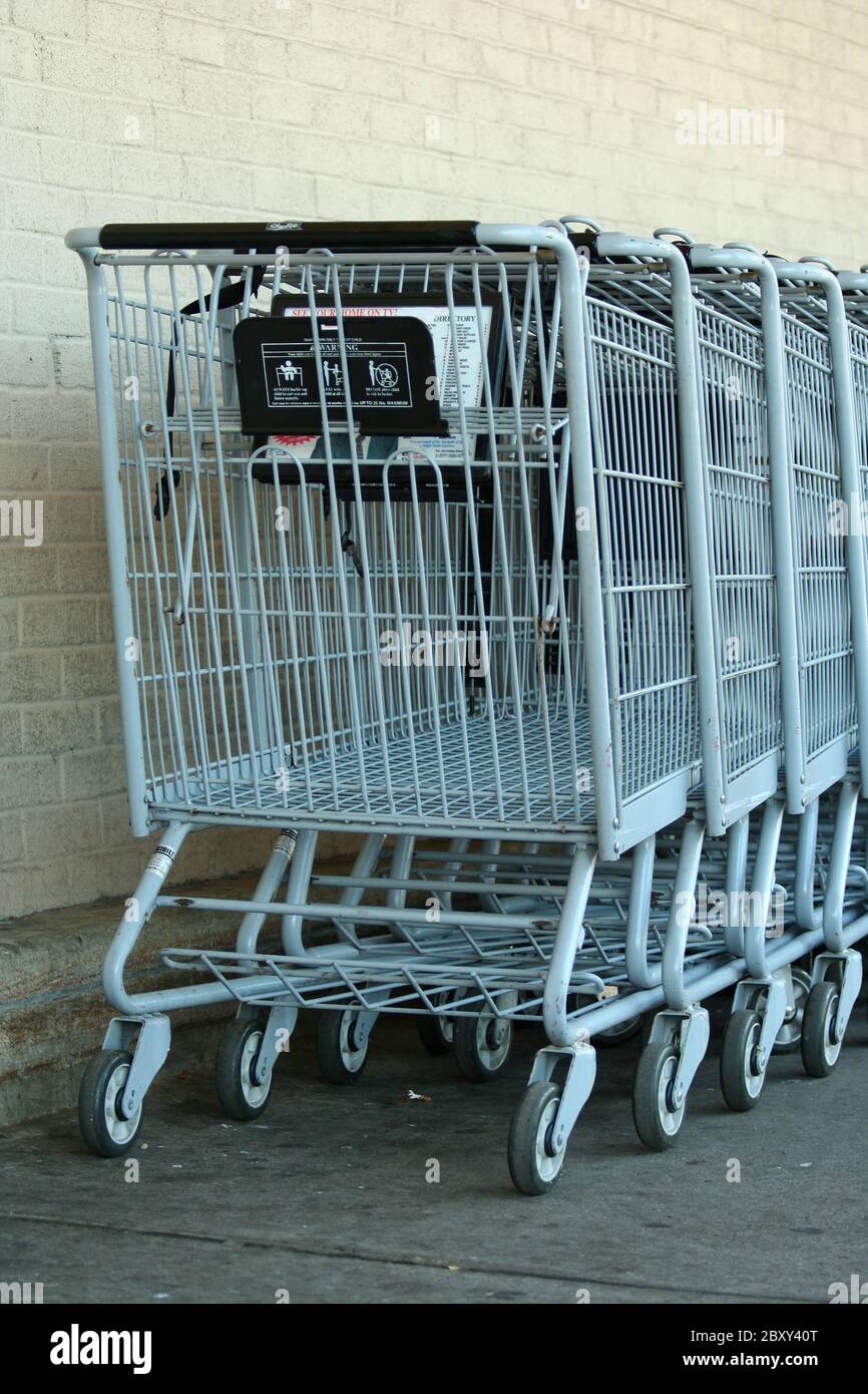 Some Grey metal shopping carts Stock Photo - Alamy