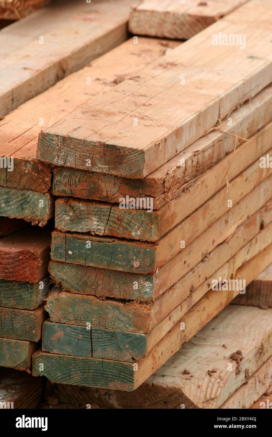 A stack of wooden boards at a construction site Stock Photo - Alamy