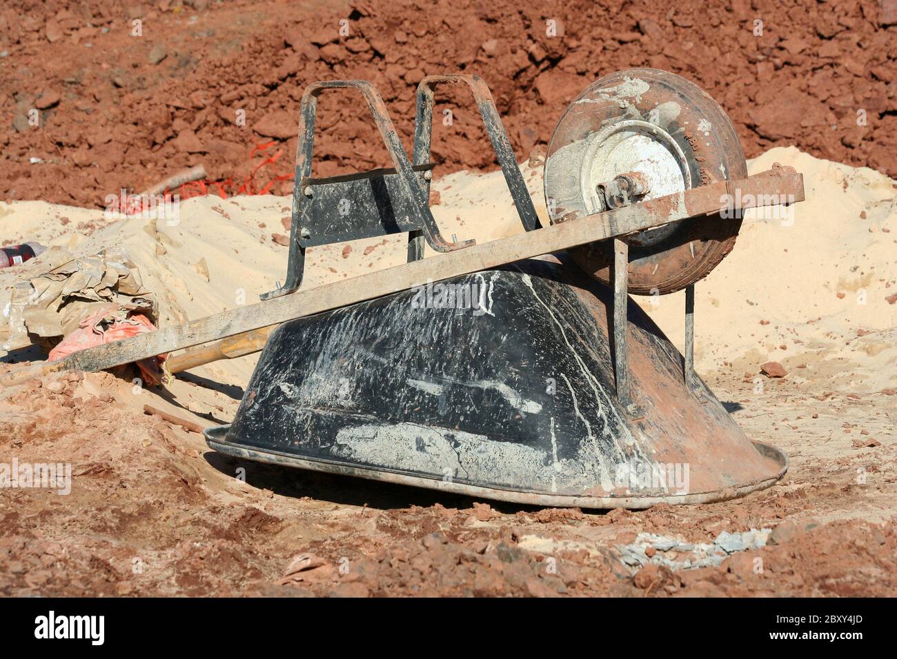A wheelborrow at a construction site Stock Photo - Alamy