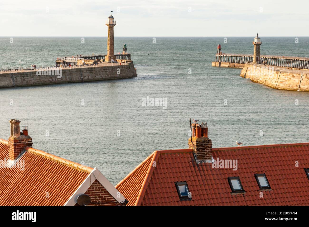 The port of Whitby with lighthouses, Scarborough, England Stock Photo ...