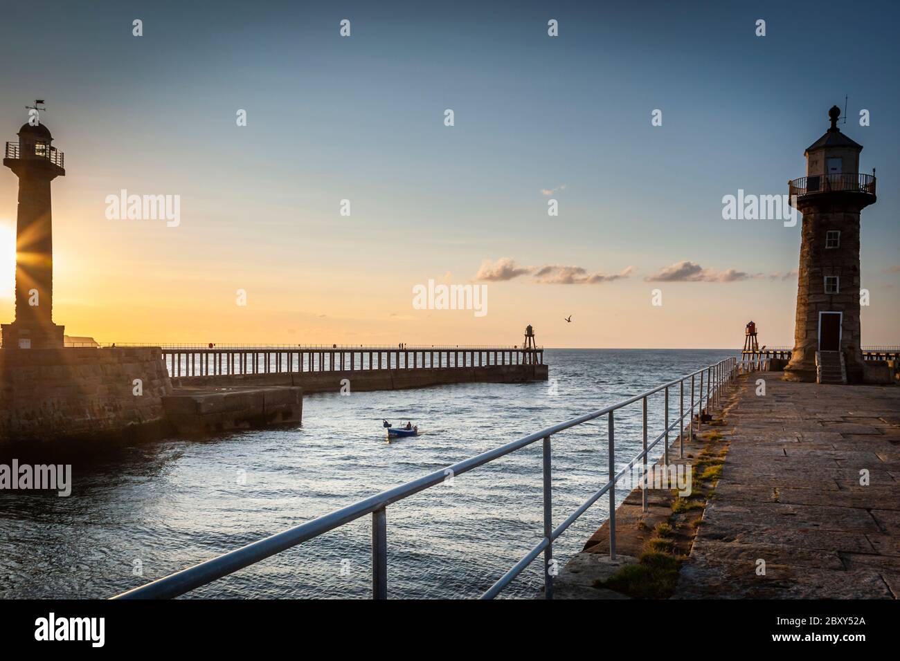 The port of Whitby with lighthouses, Scarborough, England Stock Photo ...