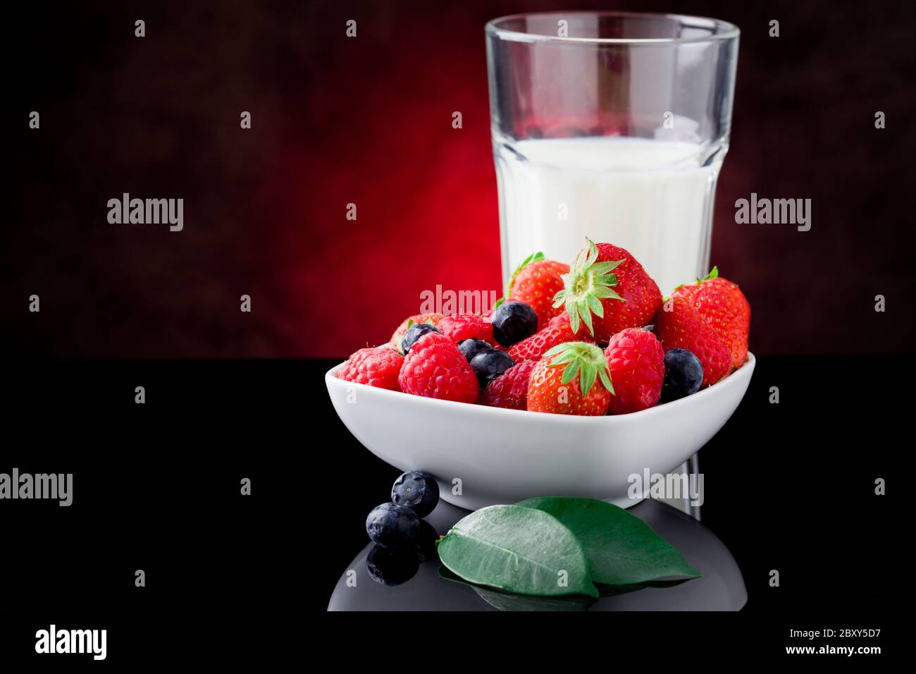 Milk and berries Stock Photo - Alamy