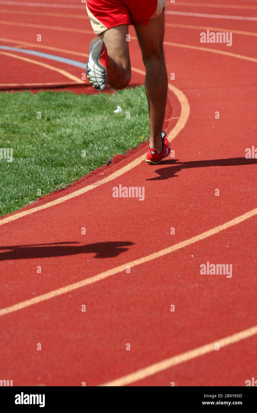 Runners running in a track race Stock Photo - Alamy