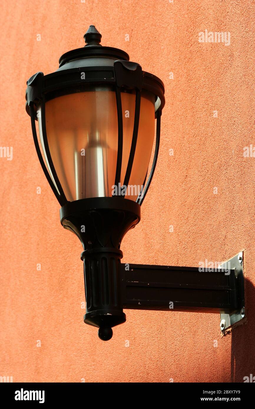 A Street light on the side of a building Stock Photo - Alamy