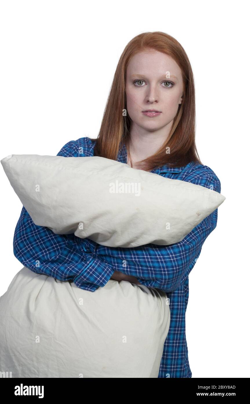 Woman Hugging Pillow Stock Photo - Alamy
