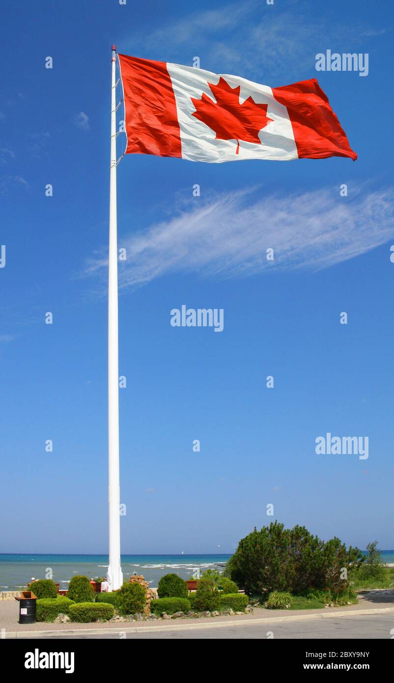 Canadian flag on windy day Stock Photo - Alamy