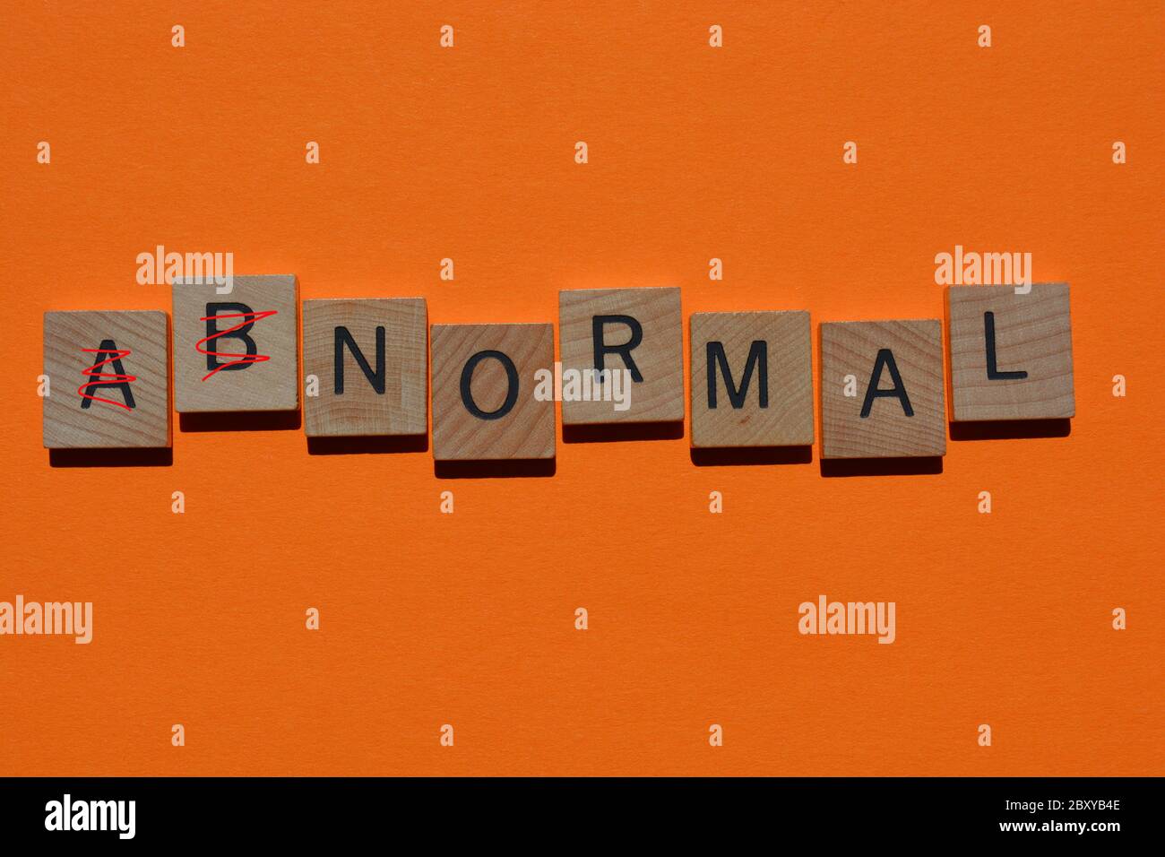 Abnormal, with ab crossed out in red, leaving the word normal Stock ...