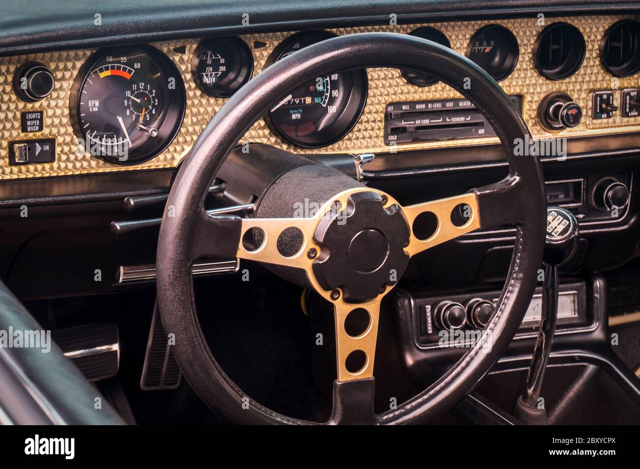 Steering wheel, speedometer, revs, clock dials, radio scale, buttons ...