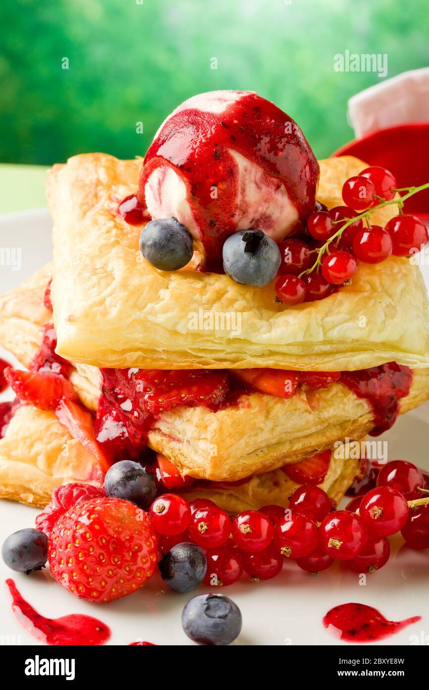 Puff pastry with berries and ice cream Stock Photo - Alamy
