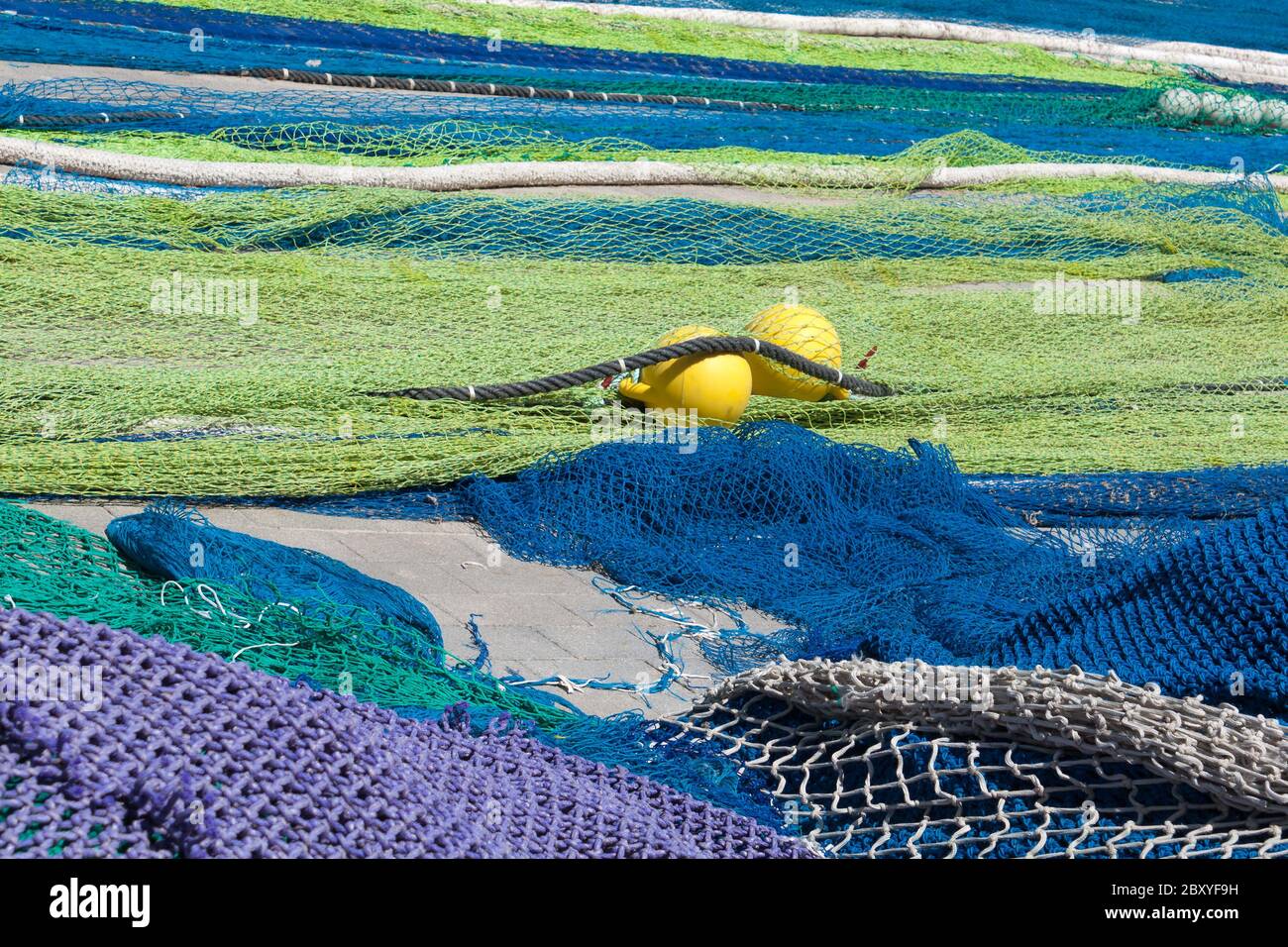 colorful fishing nets on the pier Stock Photo - Alamy