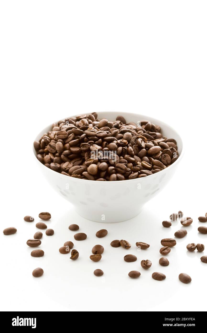 Coffee Beans inside a white bowl Stock Photo - Alamy