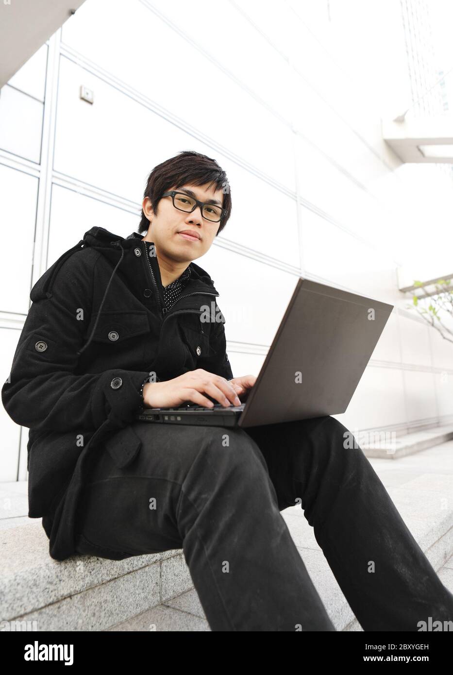man using computer outdoor Stock Photo - Alamy