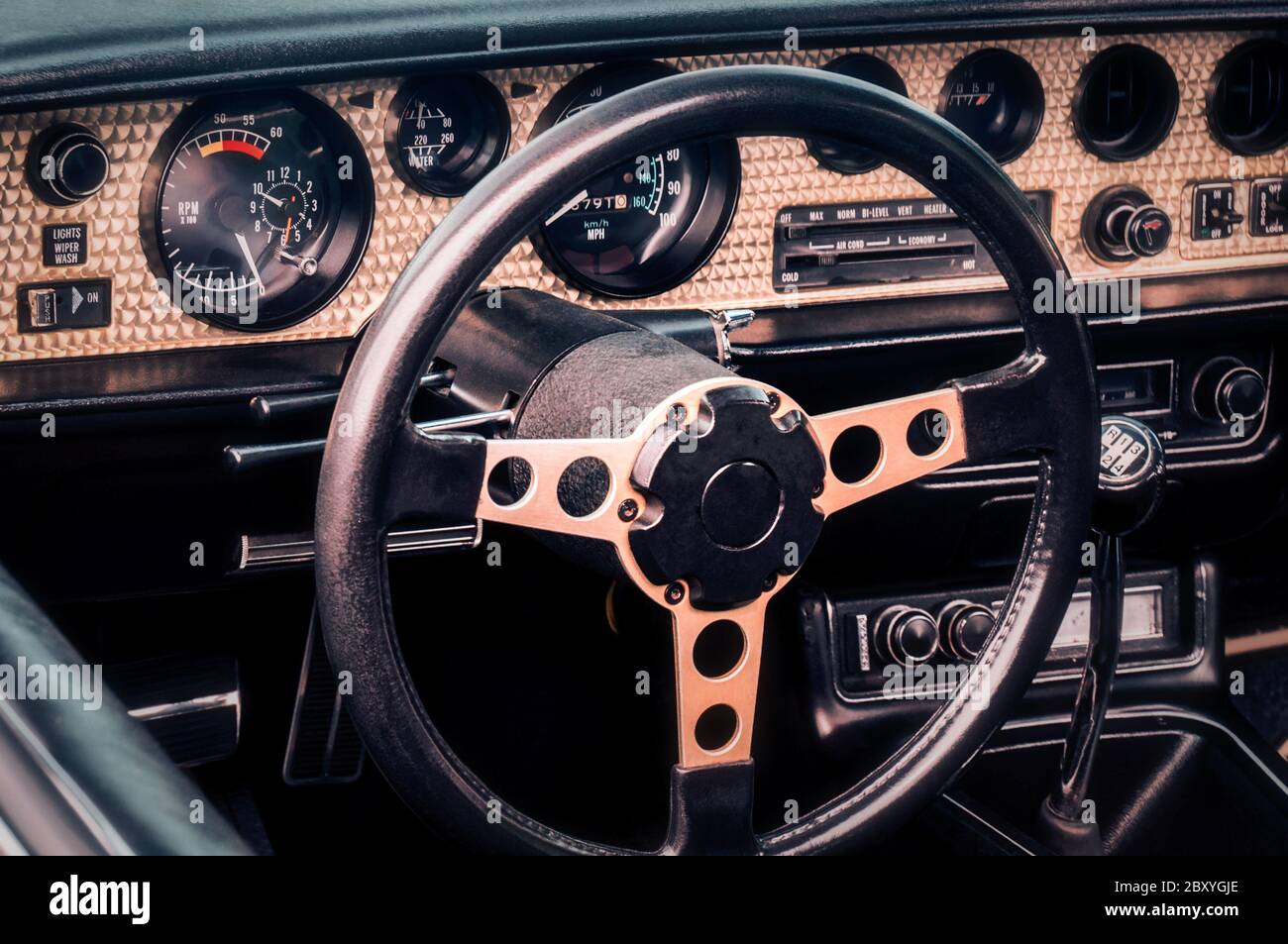 Steering wheel, speedometer, revs, clock dials, radio scale, buttons ...