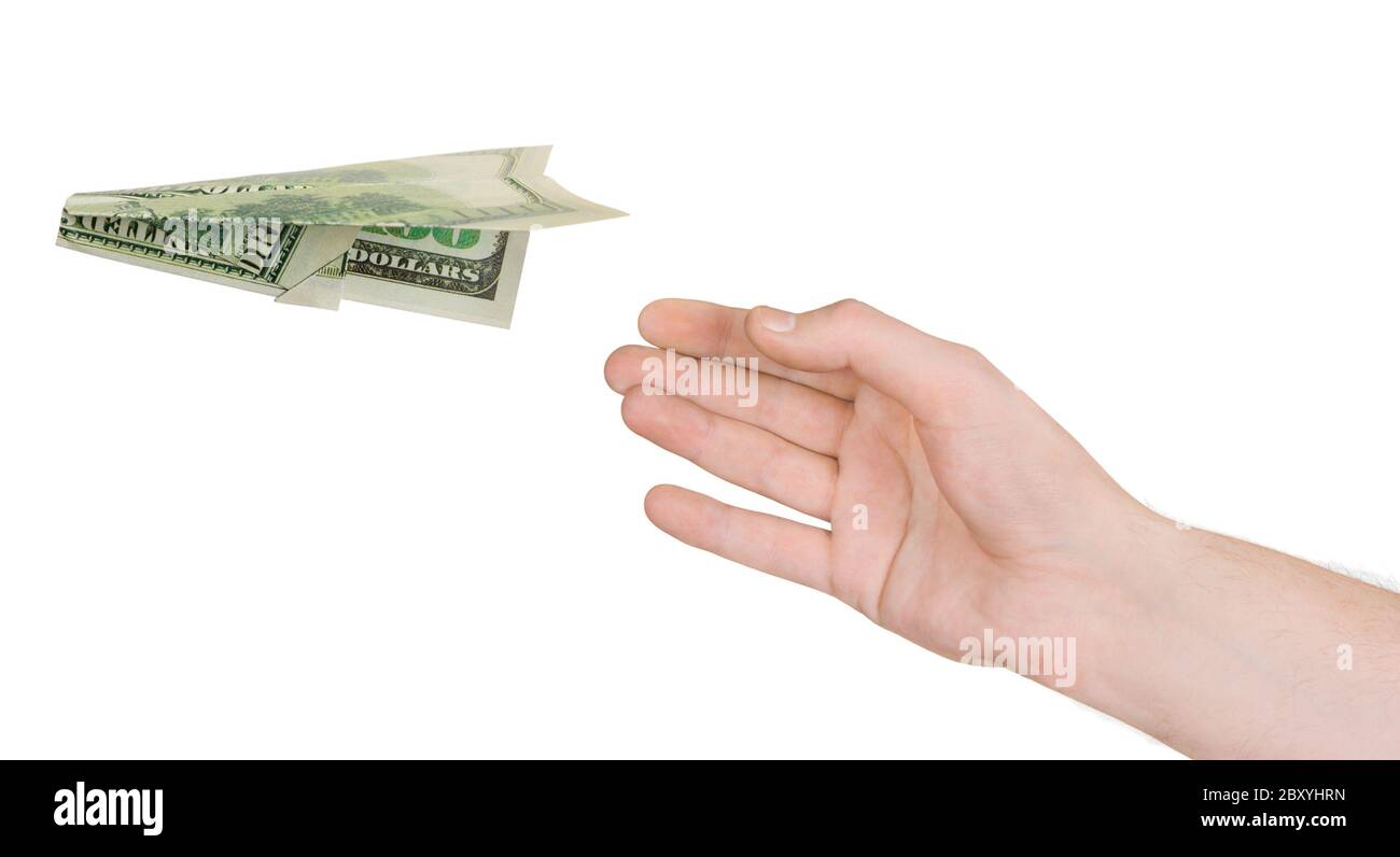 Hand and flying money plane Stock Photo - Alamy