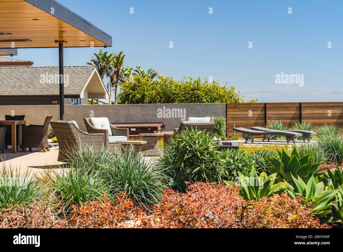 Beautiful beach house with nicely landscaped of front the yard, with ...