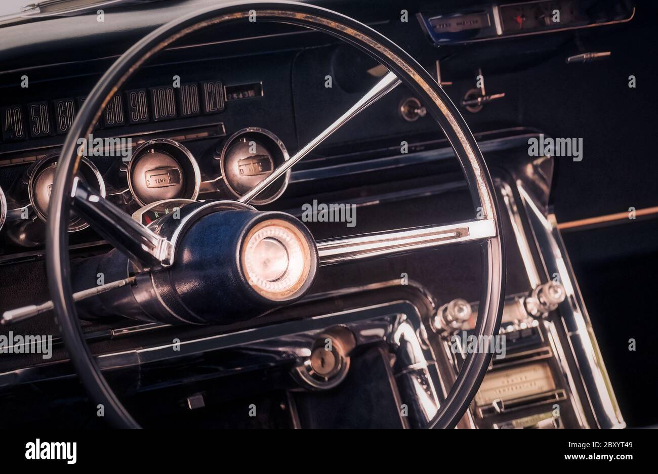Steering wheel, dials and knobs on dashboard and front panel of an old ...