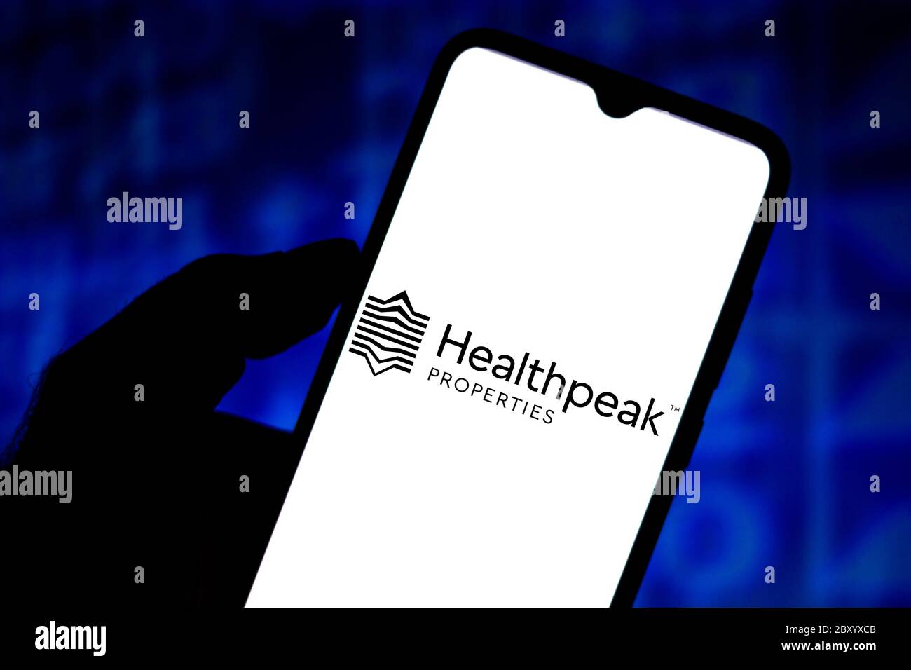 In this photo illustration the Healthpeak Properties logo seen ...