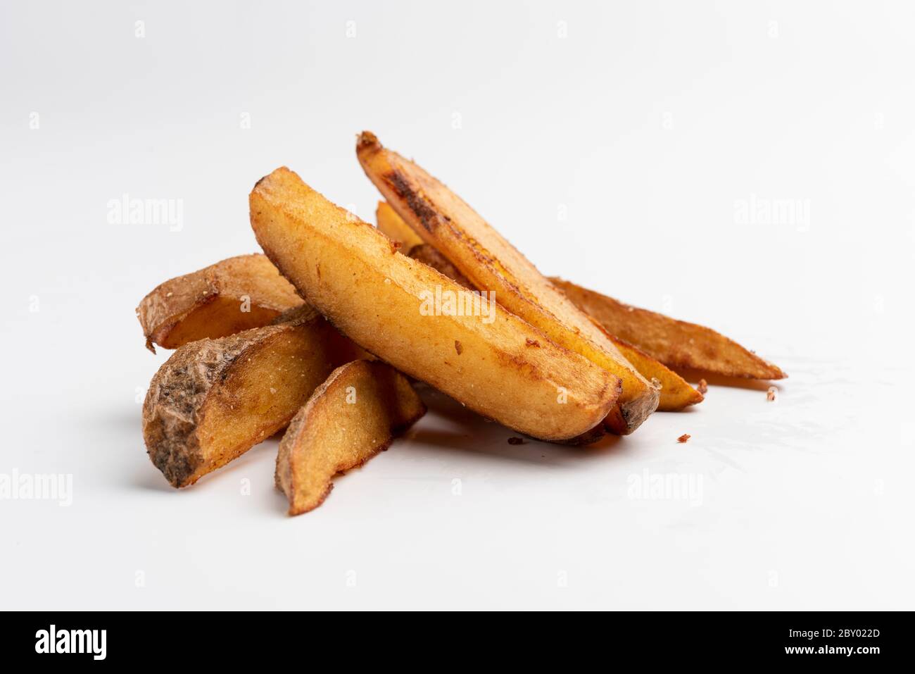 rustic homemade french fries on white background portion os fries ...