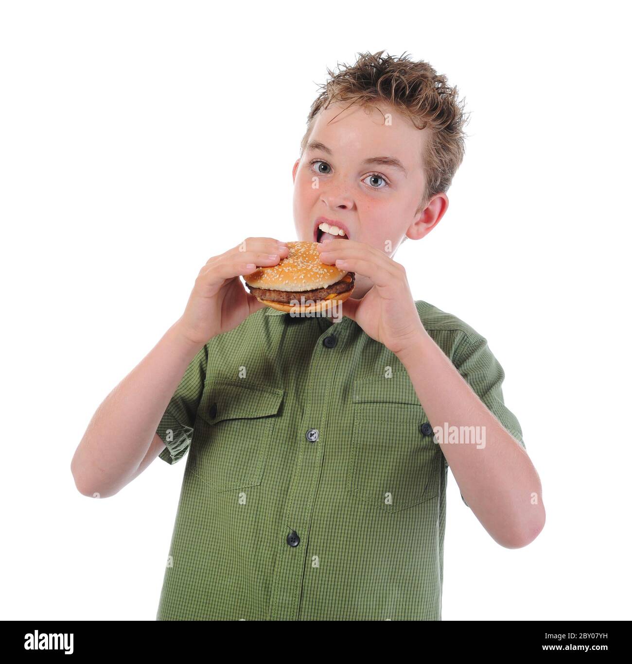 Little boy eating a hamburger Stock Photo - Alamy